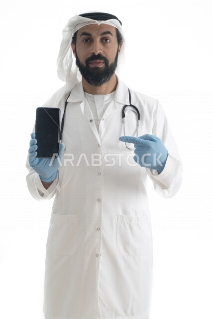Portrait of an Arab Gulf Emirati doctor in traditional attire, wearing ...