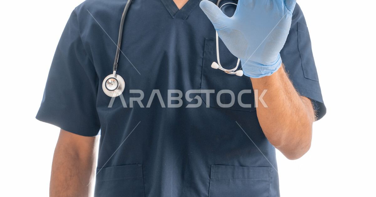 Portrait of an Arab Gulf Emirati doctor wearing a muzzle and raising ...