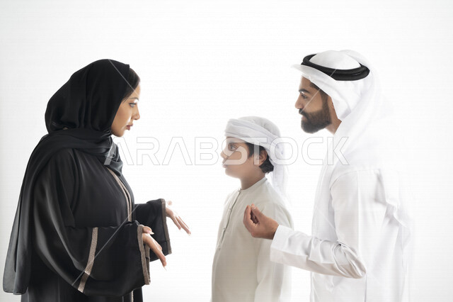 Portrait of an Arab Emirati Gulf family consisting of a father, mother ...