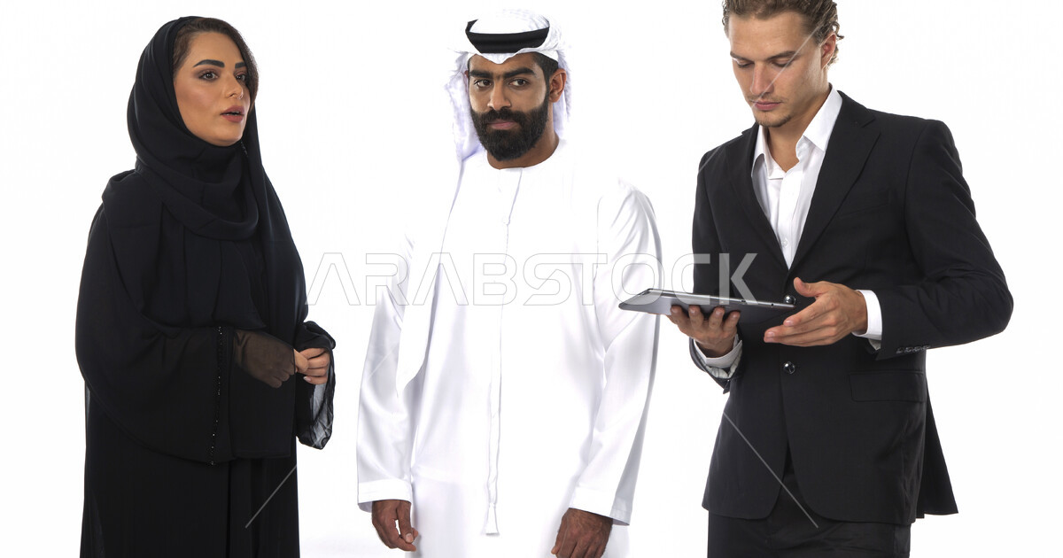 An Emirati business team and a man in a uniform in a business meeting ...