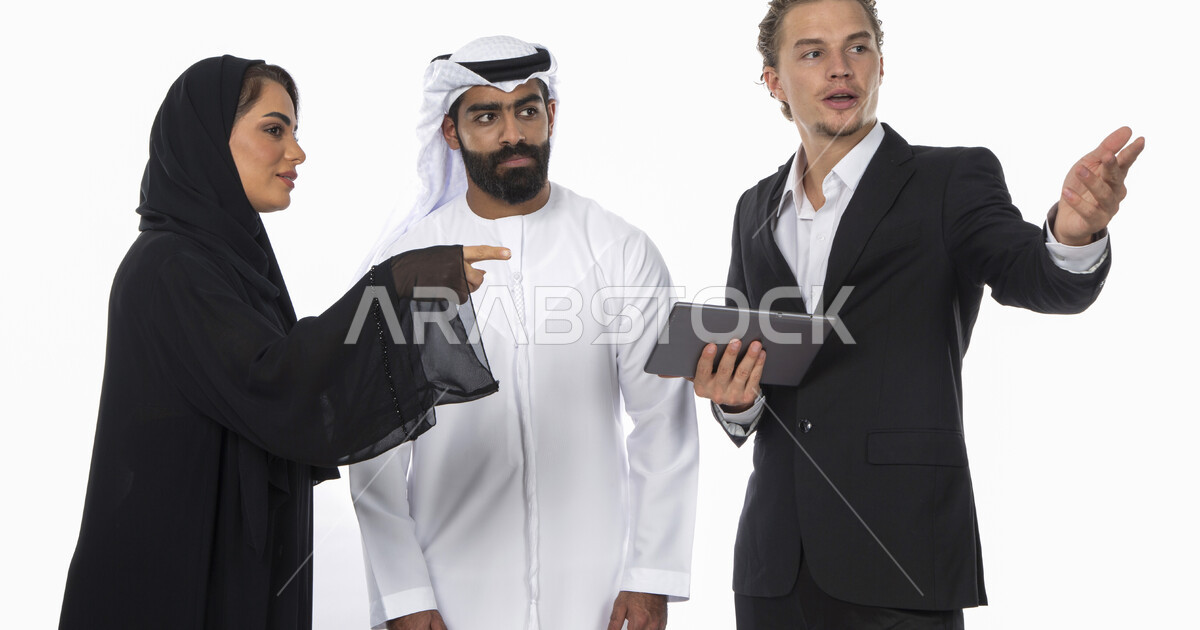 An Emirati business team and a man in a uniform in a business meeting ...