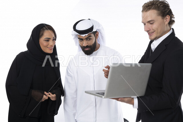 An Emirati business team and a man in a uniform in a business meeting ...