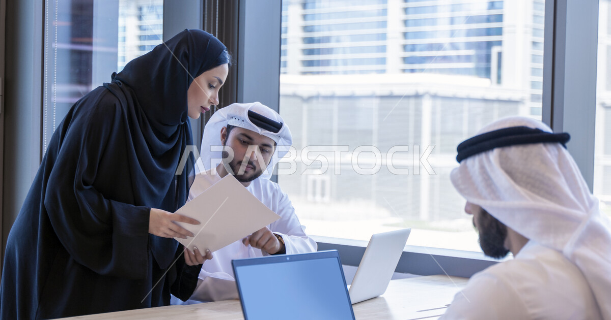 Arab-Emirati-Gulf work team in a business meeting inside the company's ...