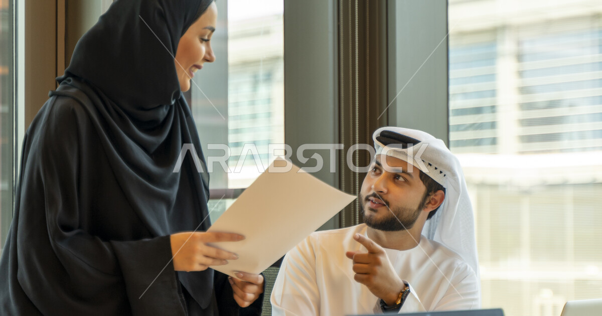 Arab-Emirati-Gulf work team in a business meeting inside the company's ...