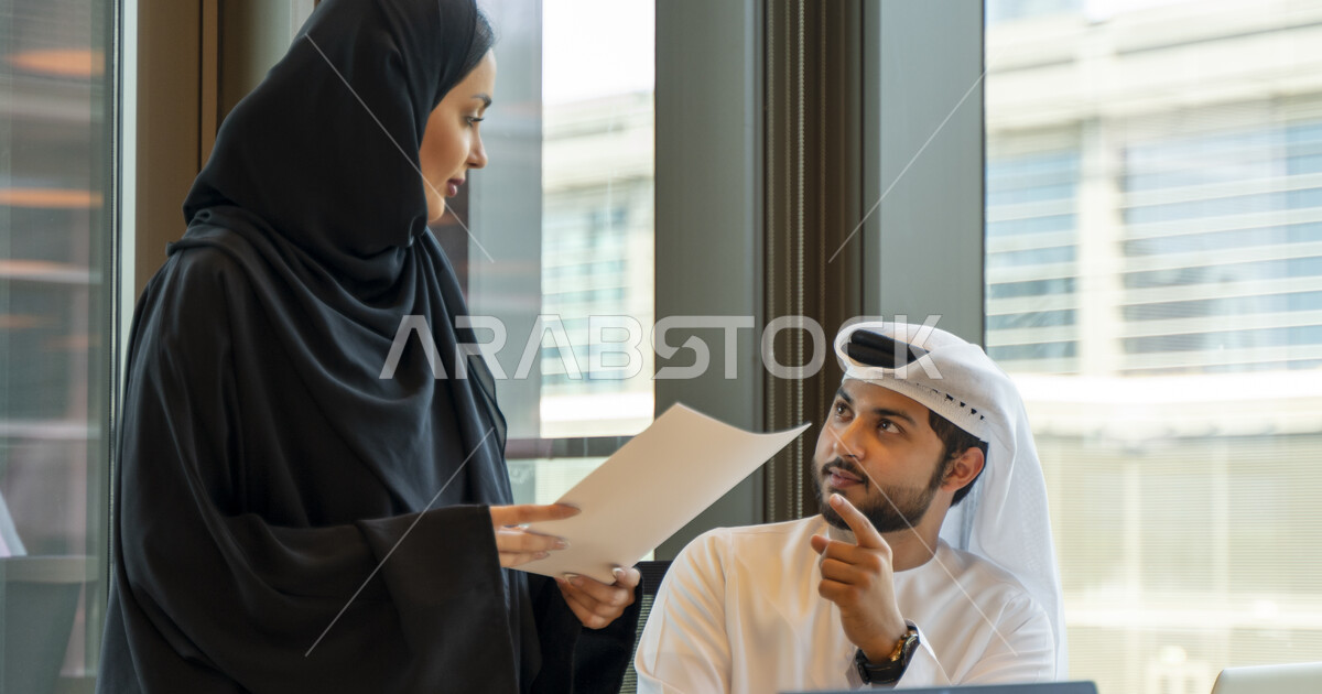 Arab-Emirati-Gulf work team in a business meeting inside the company's ...