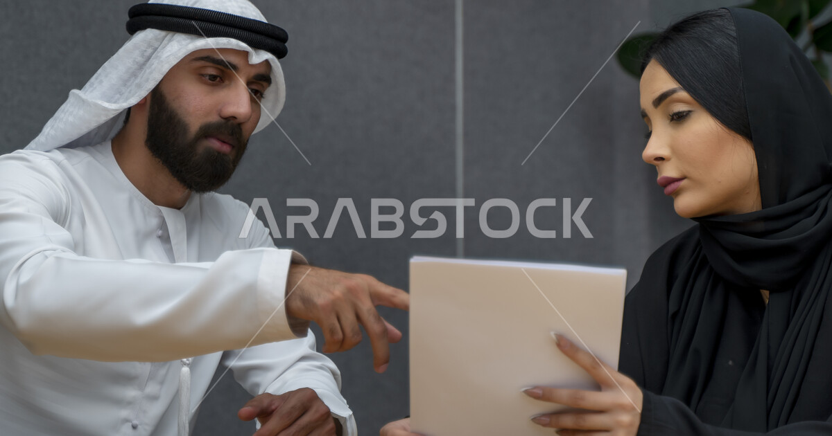 Arab-Emirati-Gulf work team in a business meeting inside the company's ...
