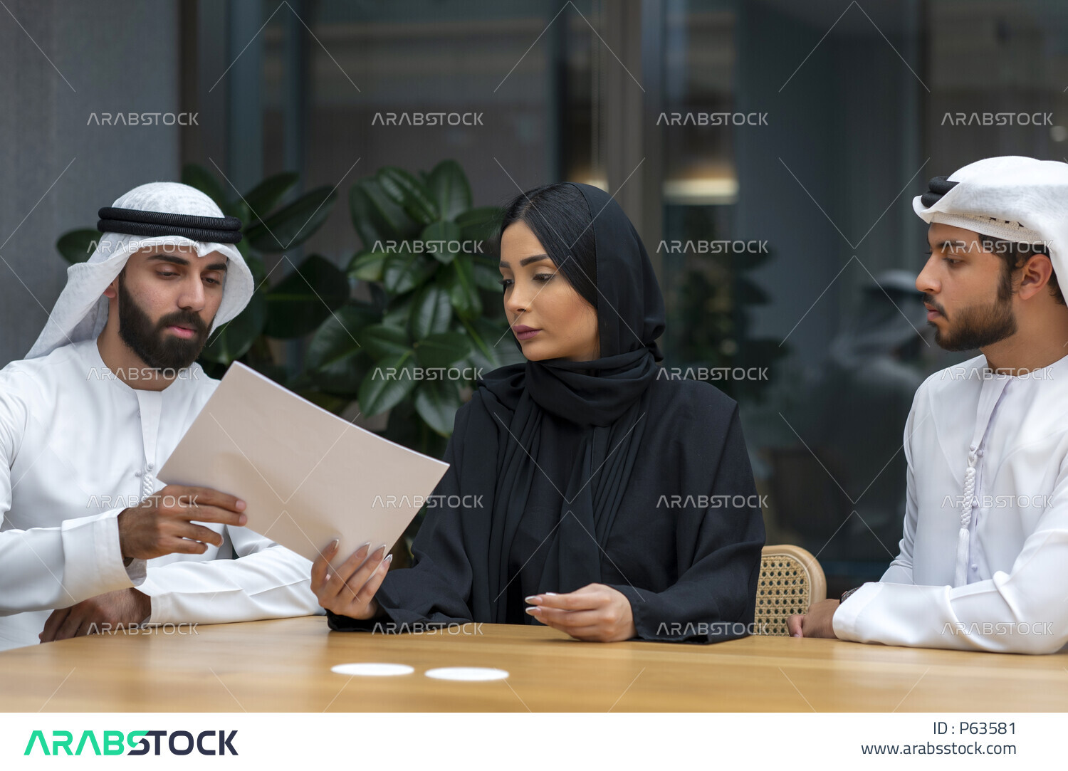 Arab-Emirati-Gulf work team in a business meeting inside the company's ...