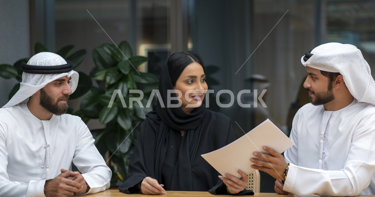 Arab-Emirati-Gulf work team in a business meeting inside the company's ...