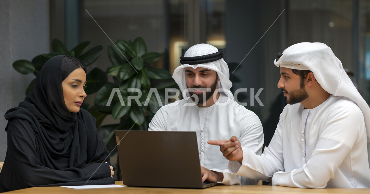 Arab-Emirati-Gulf work team in a business meeting inside the company's ...
