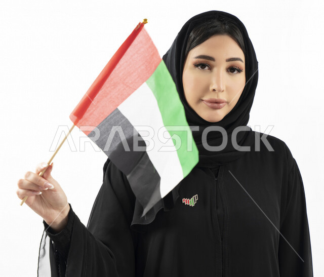 Portrait of an Emirati Arab Gulf woman, wearing the Gulf abaya, holding ...