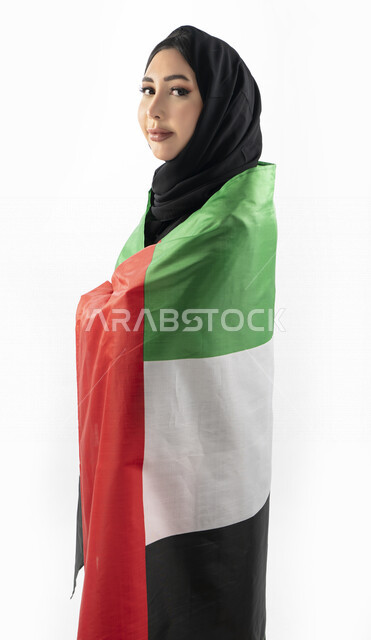 Portrait of an Emirati Arab Gulf woman, carrying the flag of the United ...
