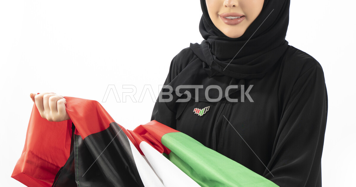 Portrait of an Emirati Arab Gulf woman, wearing the Gulf abaya, holding ...