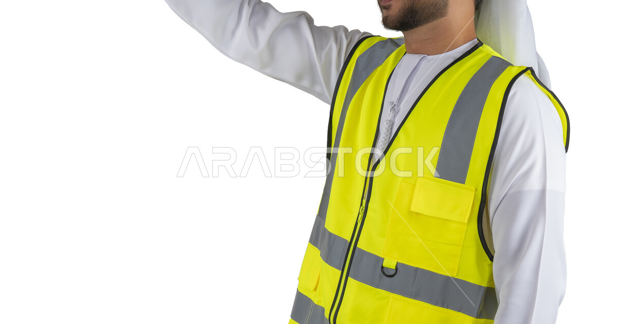 Portrait of an Arab Gulf Emirati engineer wearing a work protection ...