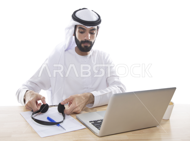 Portrait of an Arab Gulf Emirati employee working in customer service ...