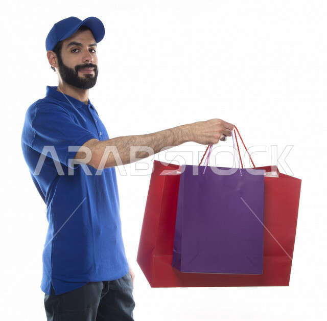Portrait of an Arab Emirati Gulf man working in delivering orders and ...