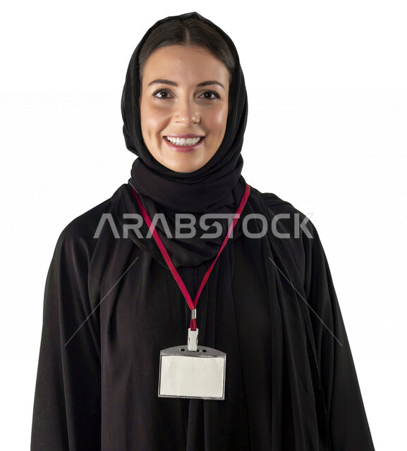 Portrait of a smiling, veiled Emirati Arab Gulf woman, wearing a blank ...