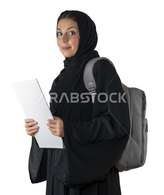 Portrait of a smiling, veiled Arab Emirati Gulf university student ...