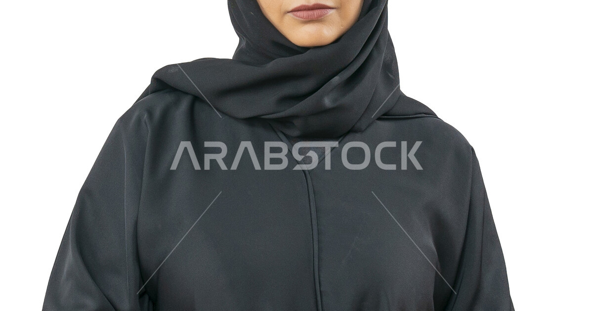 Portrait of an Emirati Arab Gulf woman wearing abaya and hijab, making various gestures holding ...
