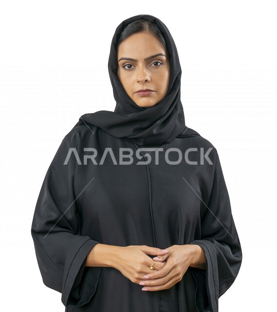 Portrait of an Emirati Arab Gulf woman wearing abaya and hijab, making various gestures holding ...