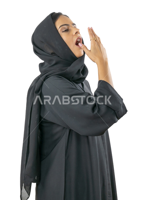 Portrait of an Arab Emirati Gulf woman wearing an abaya and a veil, making facial gestures ...