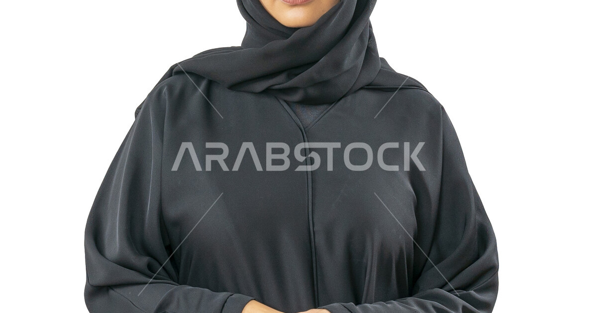 Portrait of an Emirati Arab Gulf woman wearing abaya and hijab, making various gestures holding ...