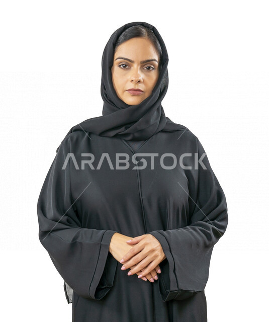 Portrait of an Emirati Arab Gulf woman wearing abaya and hijab, making various gestures holding ...
