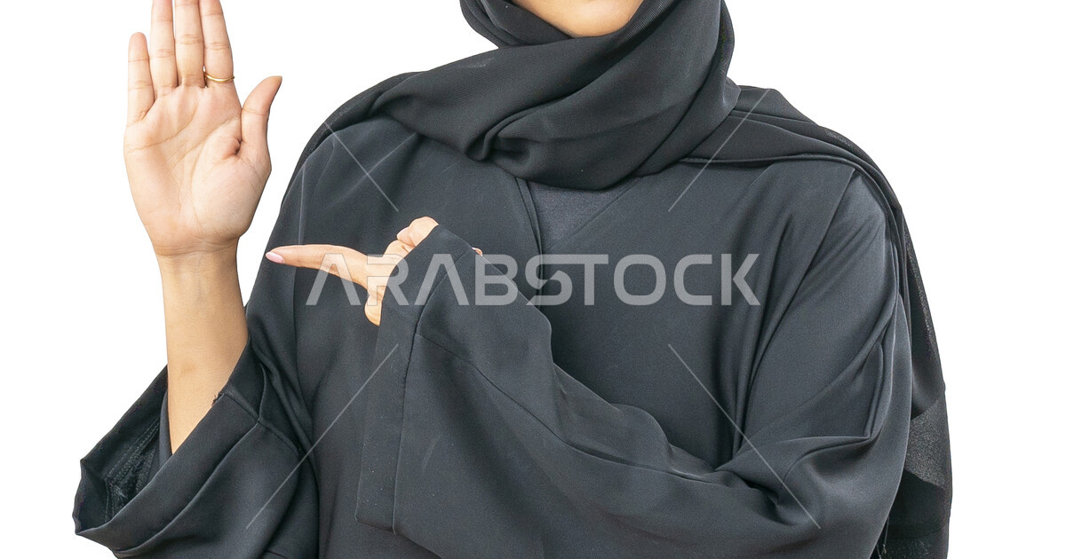 Portrait of an Arab Emirati Gulf woman wearing abaya and hijab, two hands gestures indicating ...