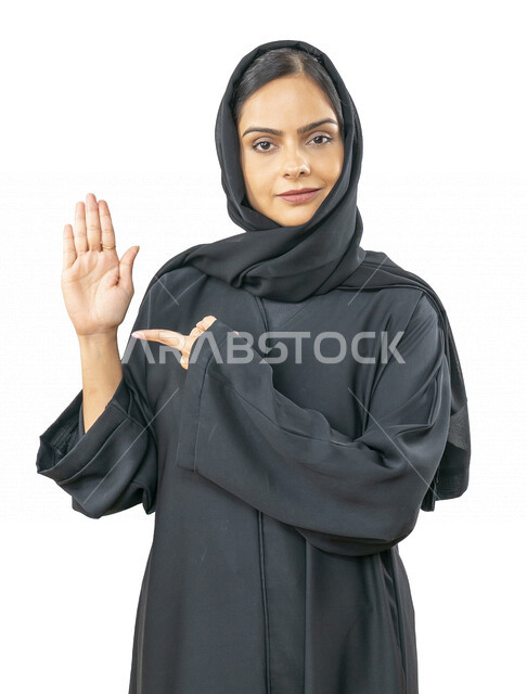 Portrait of an Arab Emirati Gulf woman wearing abaya and hijab, two hands gestures indicating ...