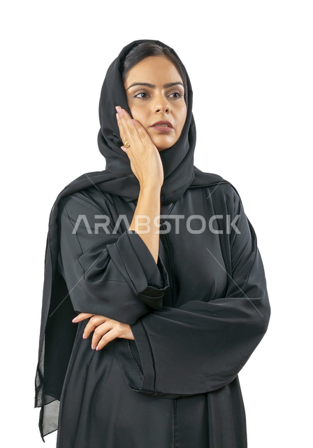 Portrait of an Arab Emirati Gulf woman wearing abaya and hijab, making facial gestures ...
