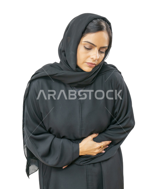 Portrait of an Arab Emirati Gulf woman wearing abaya and hijab, making facial gestures ...