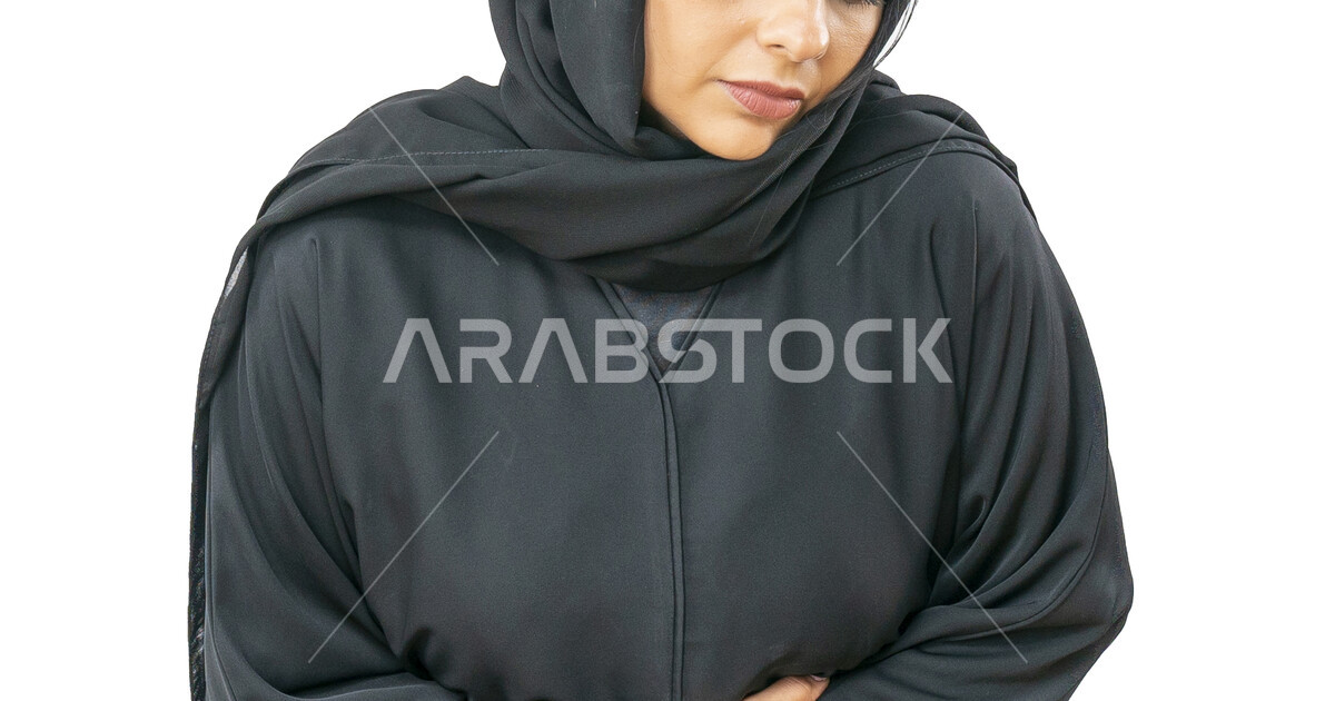 Portrait of an Arab Emirati Gulf woman wearing abaya and hijab, making facial gestures ...