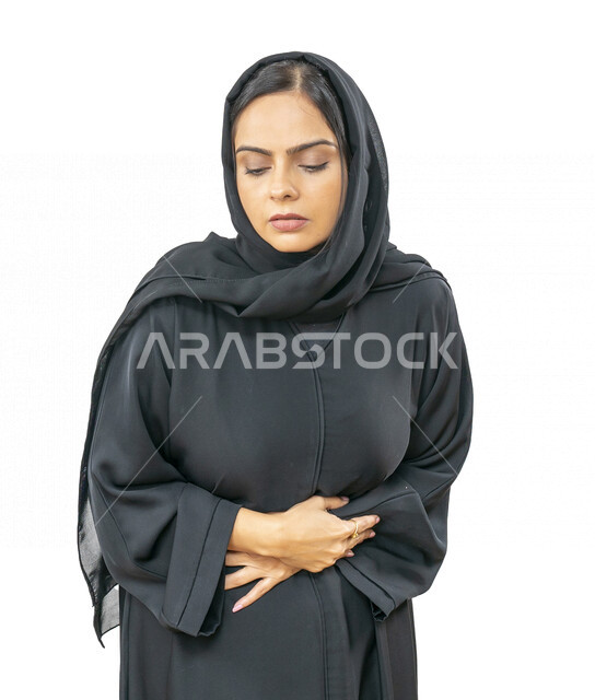 Portrait of an Arab Emirati Gulf woman wearing abaya and hijab, making facial gestures ...