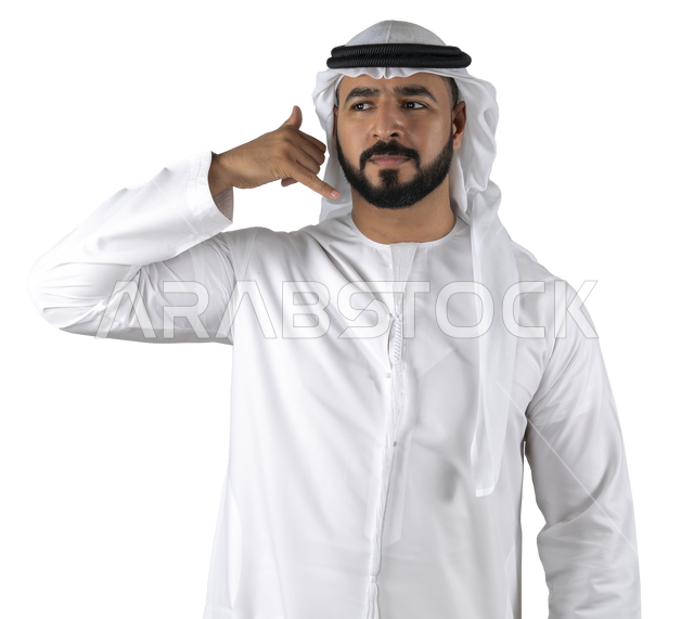 Portrait of an Arab Emirati Gulf man wearing traditional dress, making ...