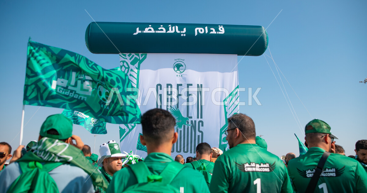 The fans of the Saudi national team cheer and encourage the Saudi ...