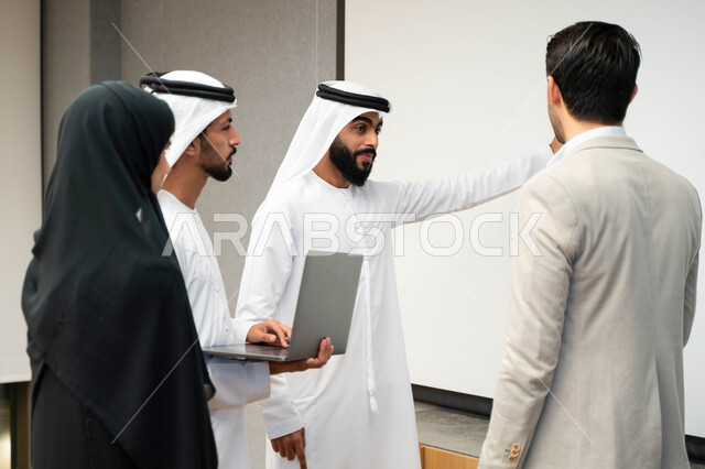 An Arab Emirati Gulf university professor explains to his students the ...