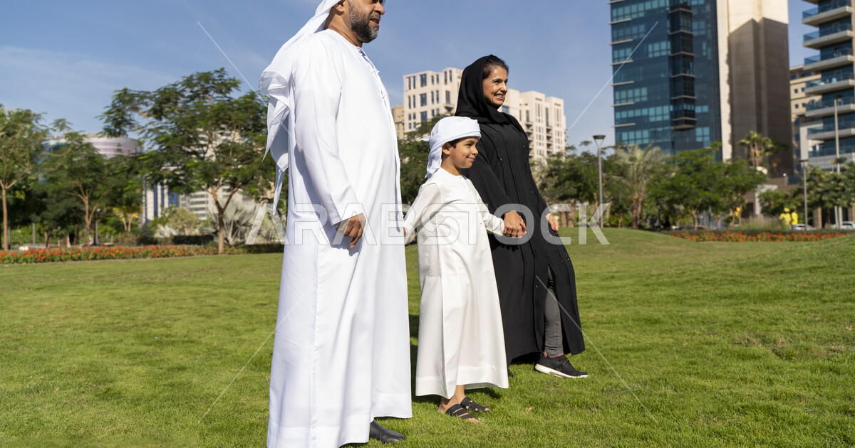 An Arab-Emirati-Gulf family consisting of three members, an Emirati ...