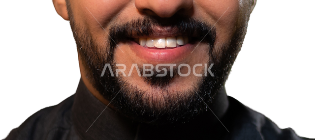 A close-up of the face of a Saudi Arabian Gulf youth, smiling facial ...