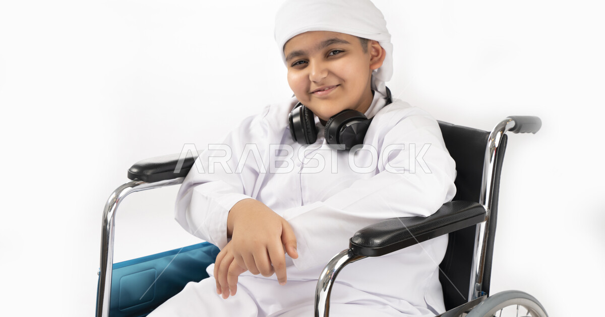 A close-up of a portrait of an Arab Emirati Gulf child dressed in the ...