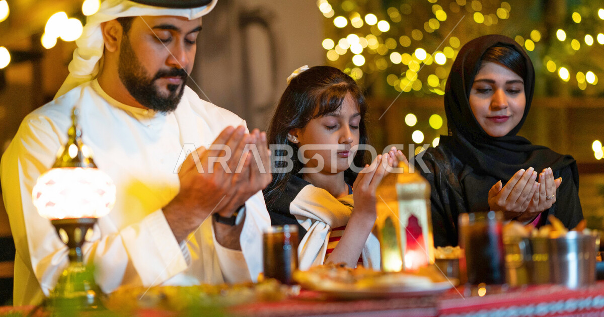 A family Ramadan breakfast in a restaurant decorated with Ramadan ...