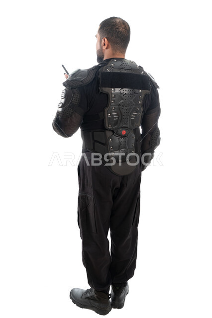 Standing with readiness and discipline, a portrait from behind of an ...