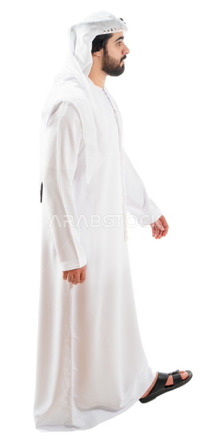 Portrait from the side of an Emirati Arab man wearing traditional ...