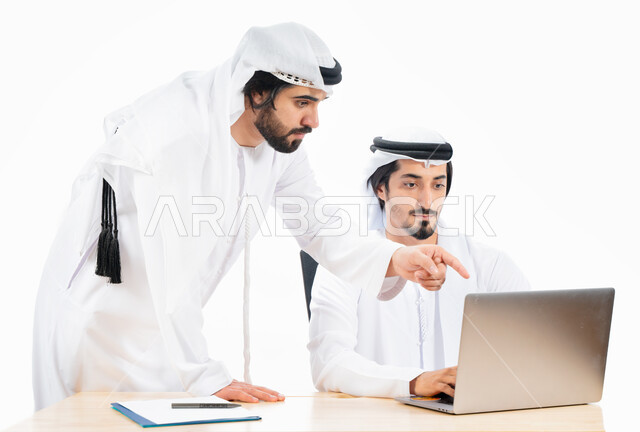Portrait of two Arab Gulf Emirati businessmen at the workplace ...