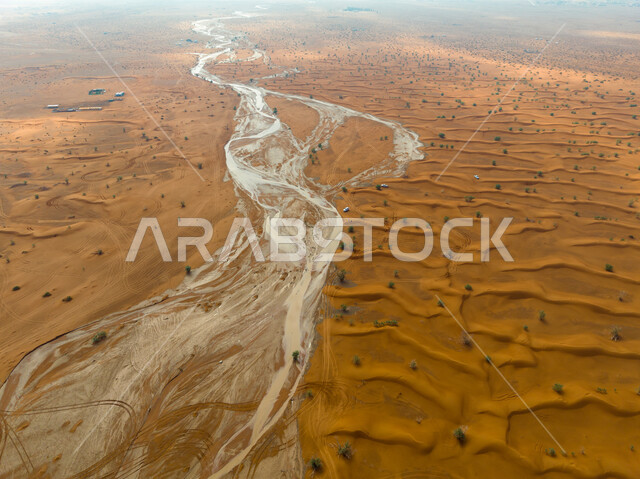 Aerial photo of the sandy desert in the Kingdom of Saudi Arabia, golden ...