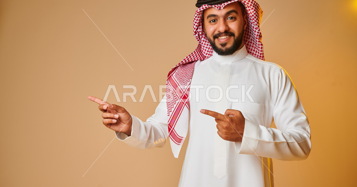 Portrait of a Saudi Arabian Gulf man pointing his index finger at ...
