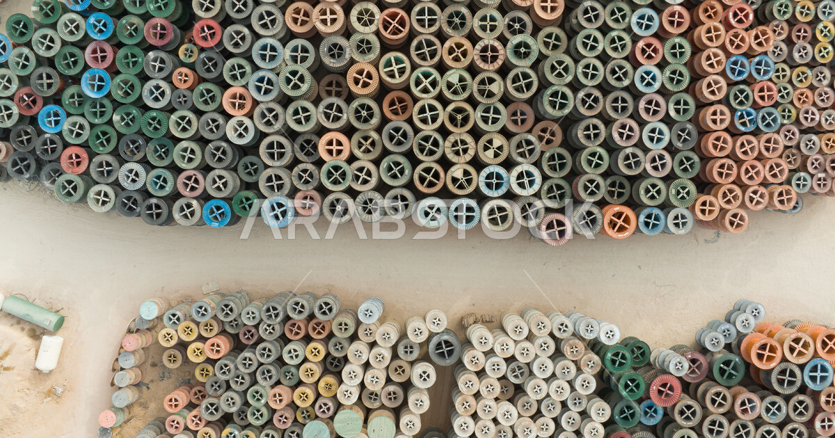 Aerial view of cable reels, equipment and extension tools, cable ...