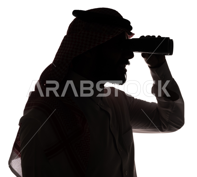 Portrait, silhouette of a Saudi Arabian Gulf man, holding a binocular ...