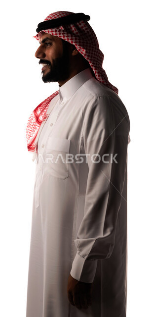 Portrait at an angle from the side of a Saudi Arabian Gulf man, dressed ...