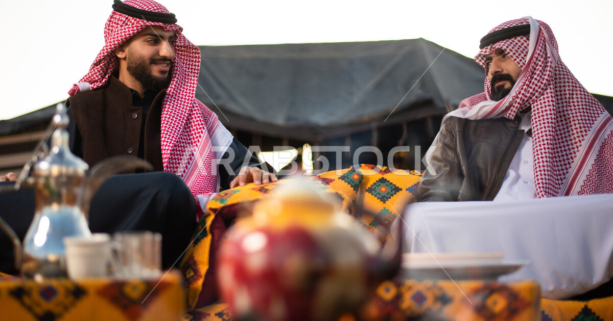 Two Saudi Arabian Gulf men dressed in warm winter clothes, good ...