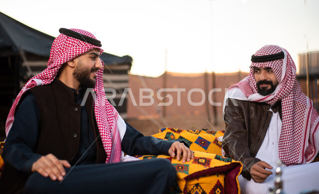 Two young Saudi Arabian Gulf men enjoying a wild camping trip in the ...