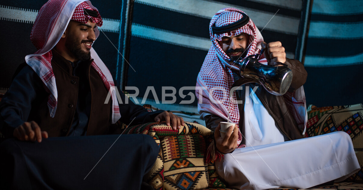 Two young Saudi Arabian Gulf men enjoying a wild camping trip in the ...